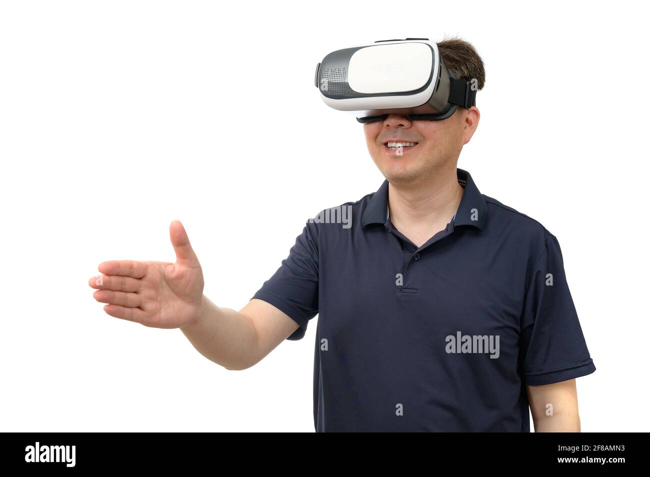 Man wearing virtual reality goggles. Studio shot, white background ...