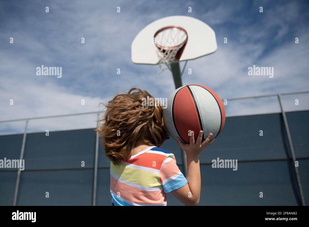 Little child boy playing basketball with basket ball. Basketball kids ...