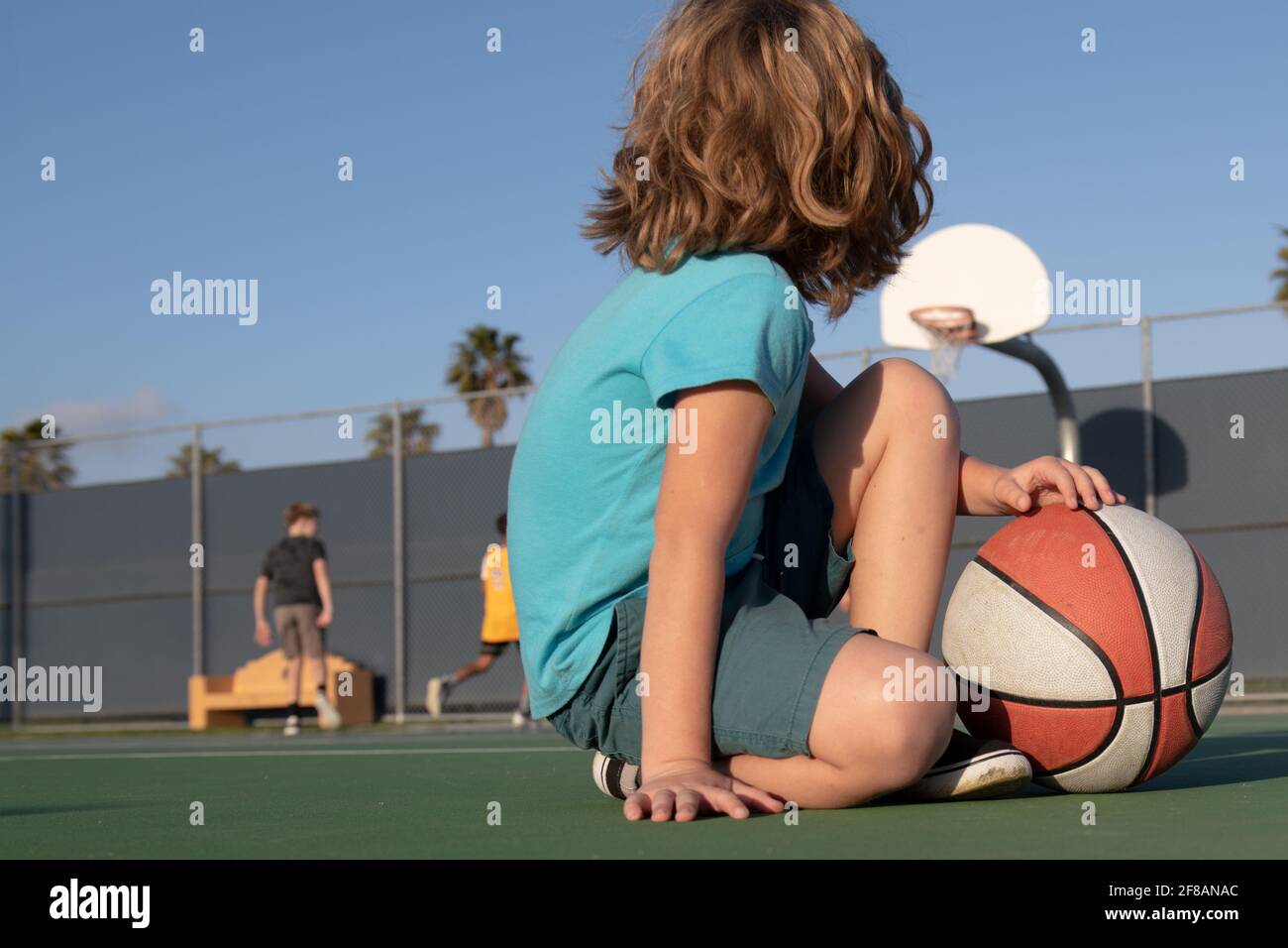 Basketball kids game. Cute little child boy holding a basket ball ...