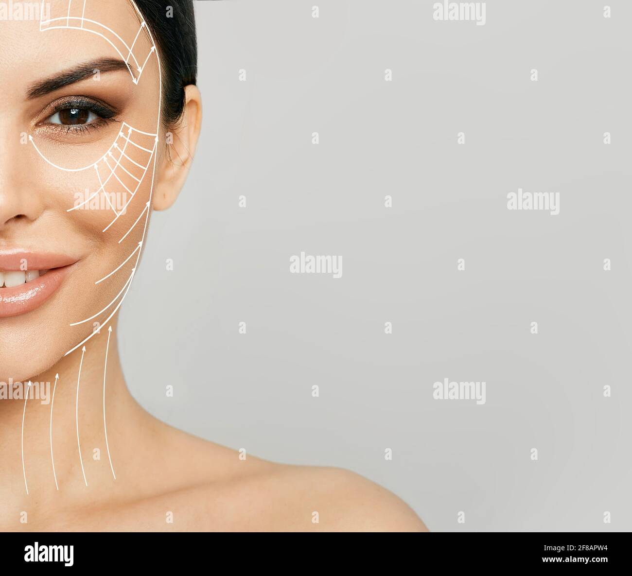 Lifting skin. Lifting lines on half of a woman's face, advertising of ...
