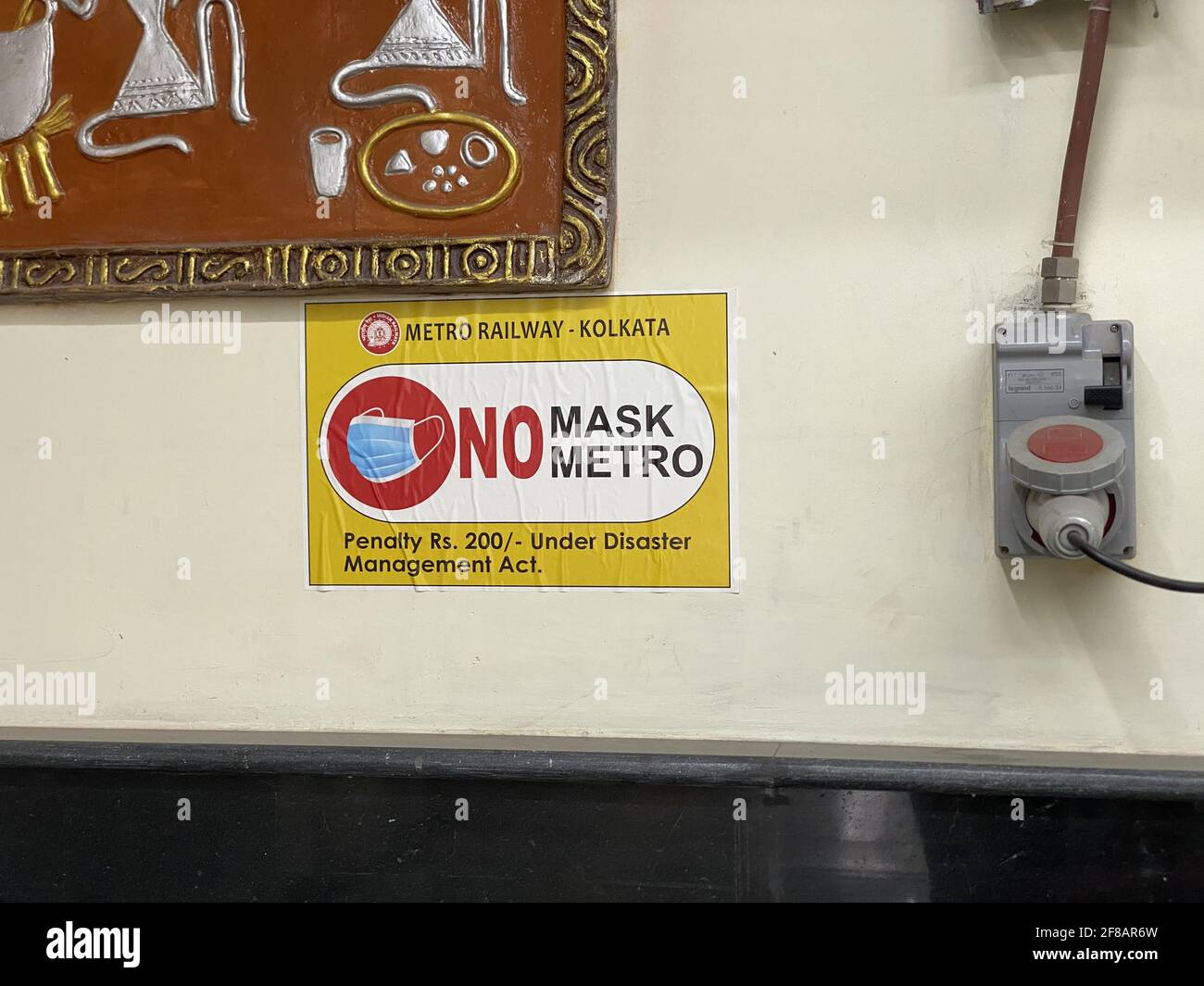 KOLKATA, INDIA - Apr 12, 2021: A sign at railway station " No mask no ...