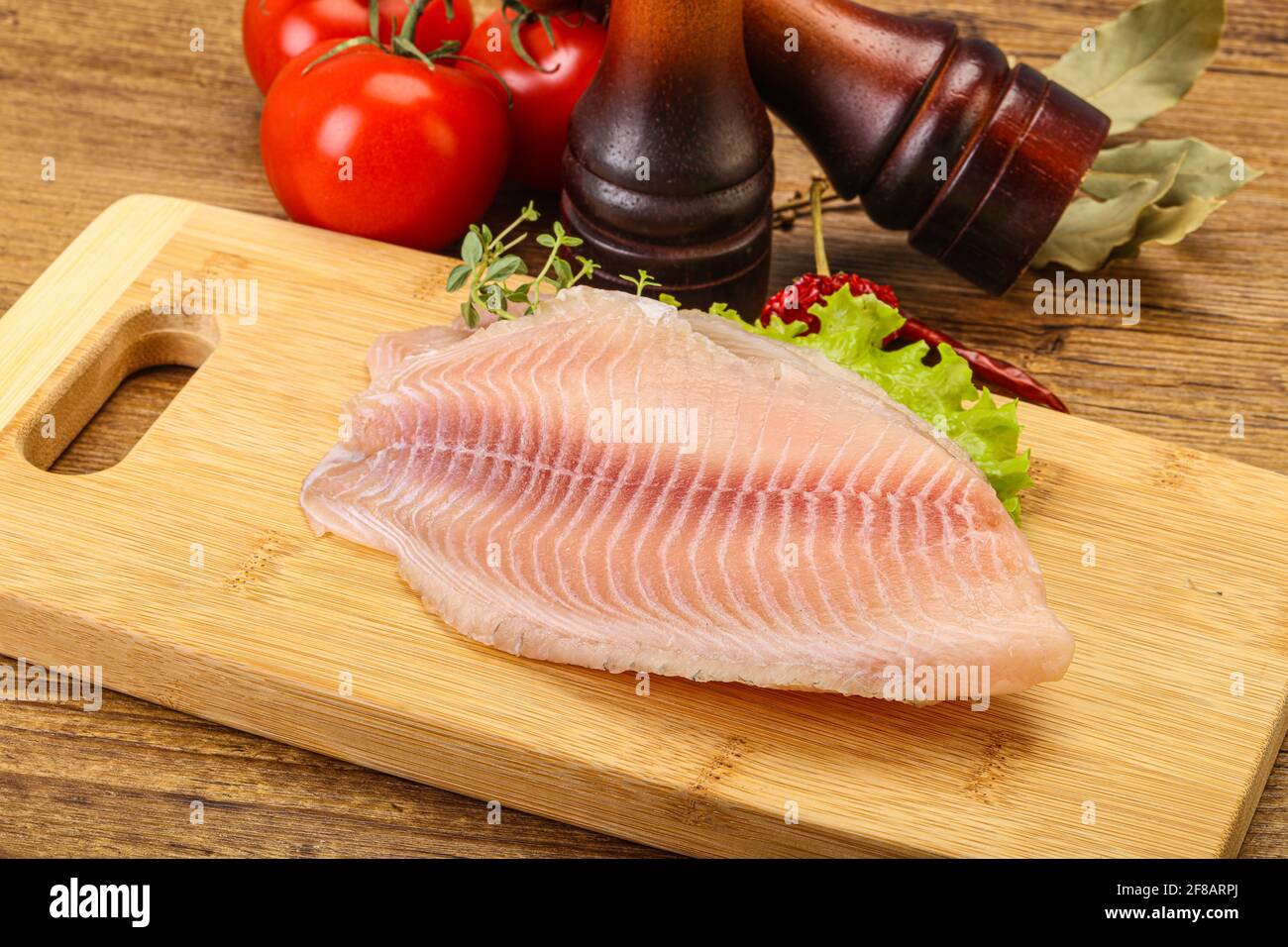 Raw tilapia fish fillet for cooking Stock Photo - Alamy