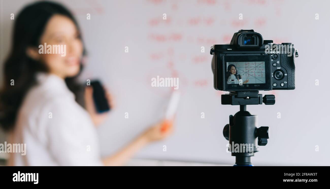 Asian female teachers are recording lessons for online teaching work ...