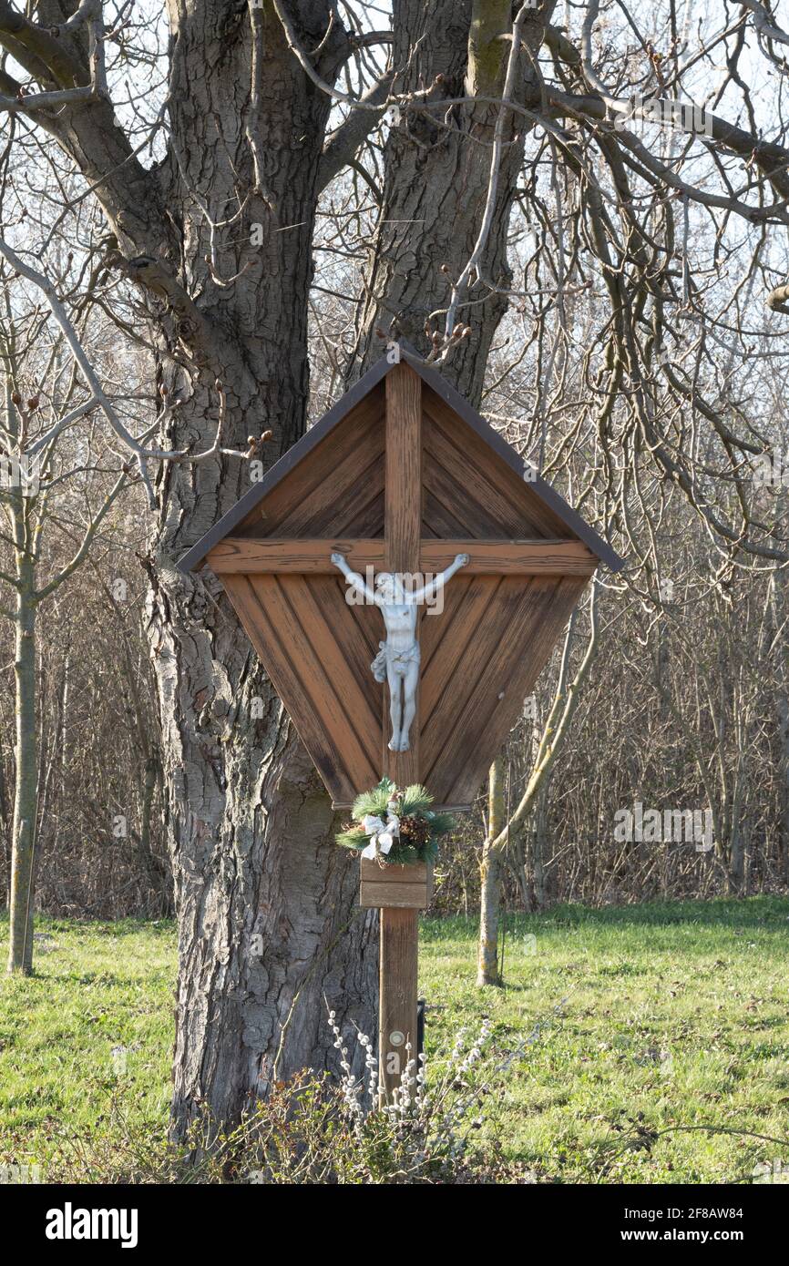 Wooden landmark with Christ crucified on cross Stock Photo - Alamy