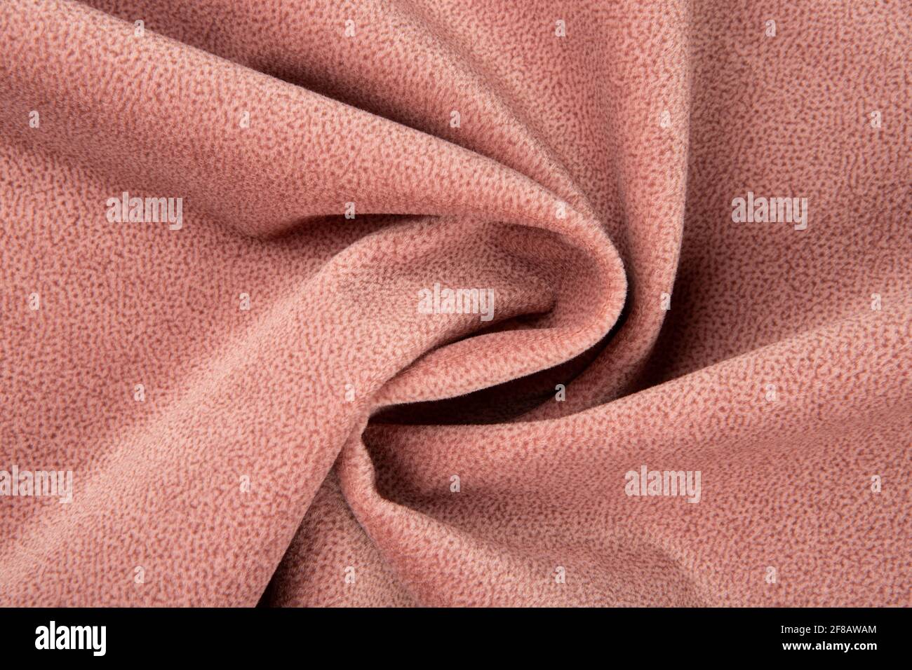 Pink fabric texture - top view and close-up of a piece of crushed and ...