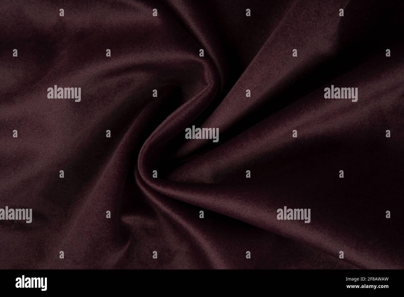Maroon fabric texture - top view and close-up of a piece of crushed and ...