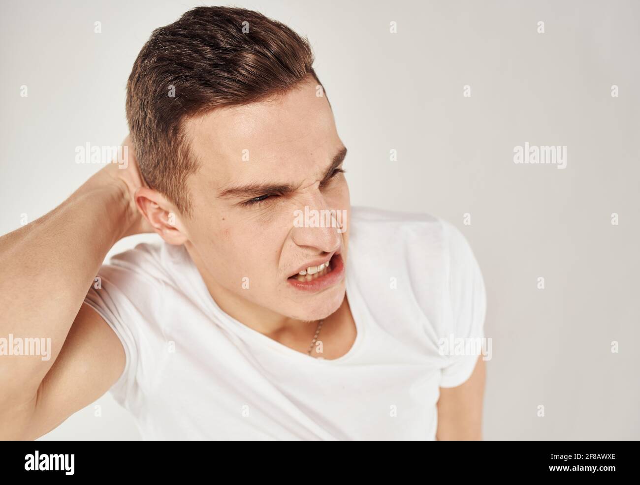 Nervous man touches his head stress Model of emotion Stock Photo - Alamy