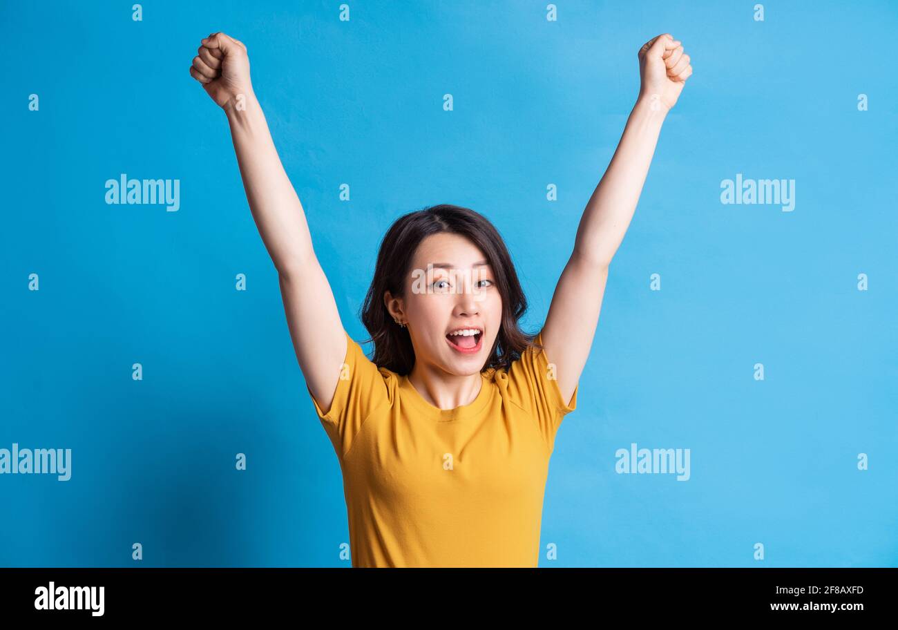 The beautiful Asian woman is showing a feeling of victory Stock Photo ...