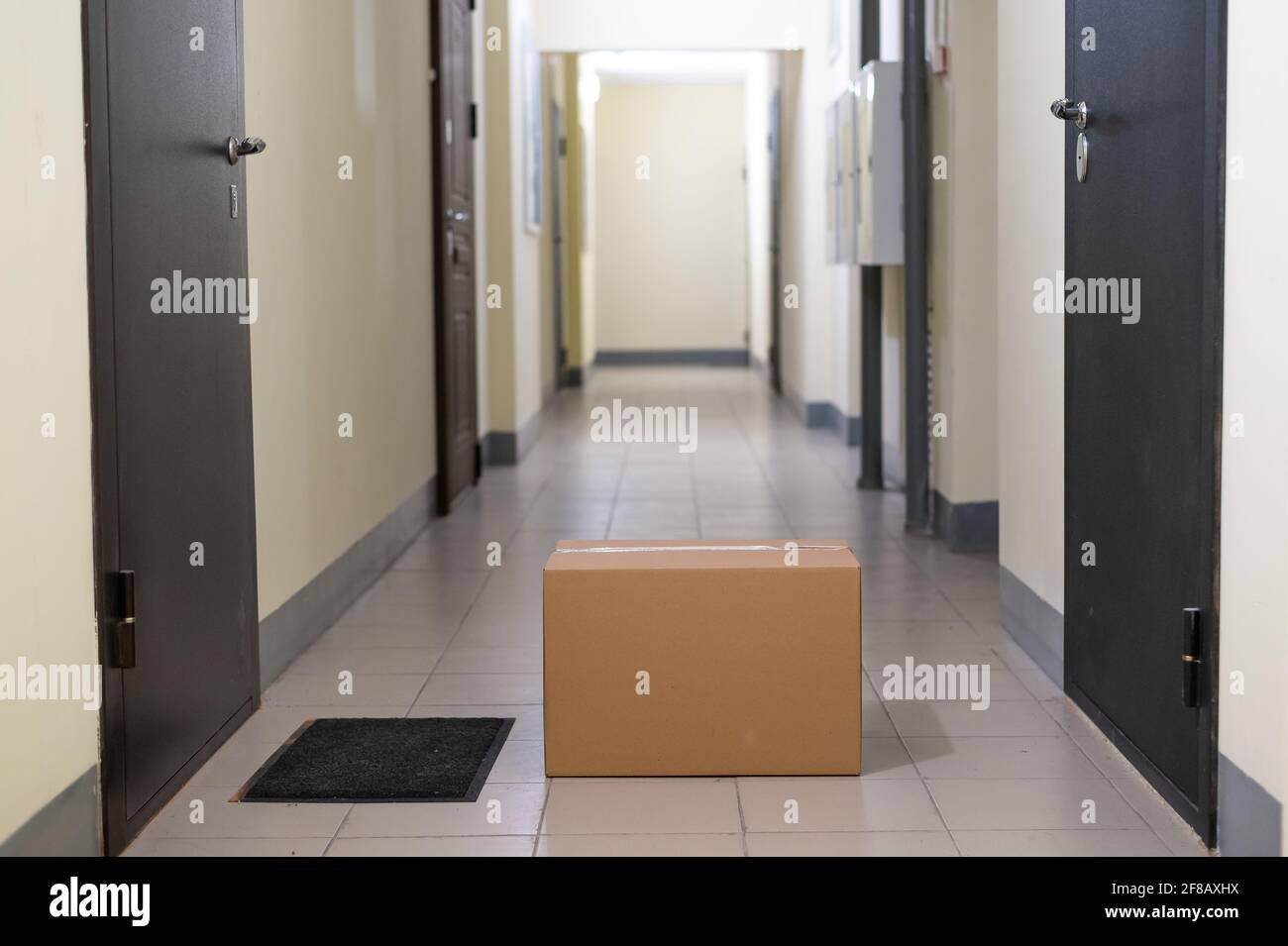 Contactless door delivery concept. Cardboard box with online purchase ...