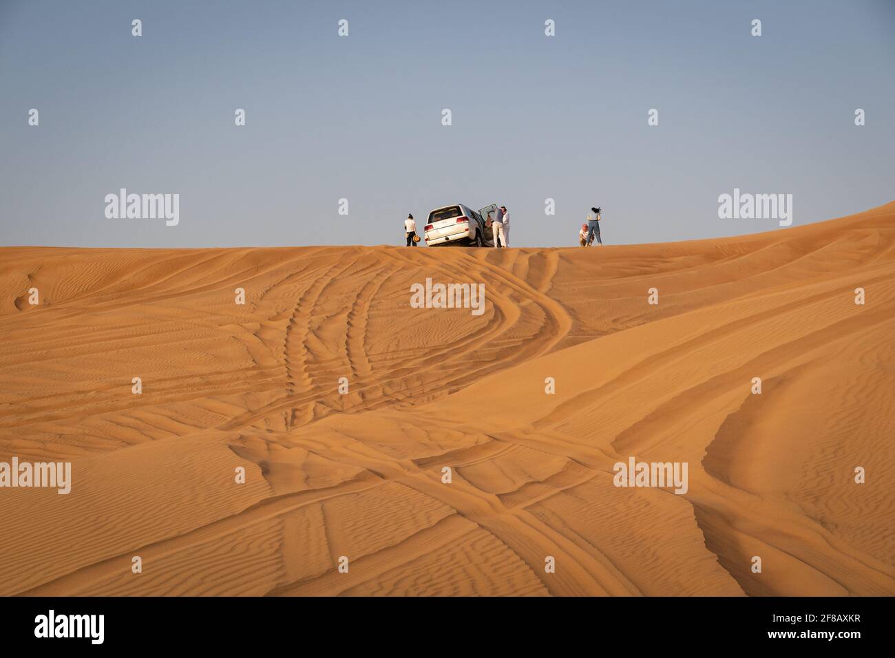 Desert safari tour in UAE. Four wheel drive desert safari car on a san ...