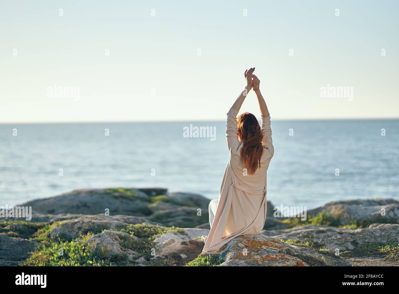 romantic woman in the mountains near the sea on nature landscape Stock ...