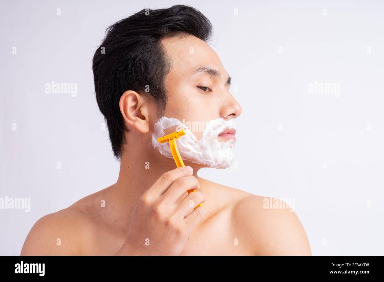 Portrait of asian man shaving Stock Photo - Alamy