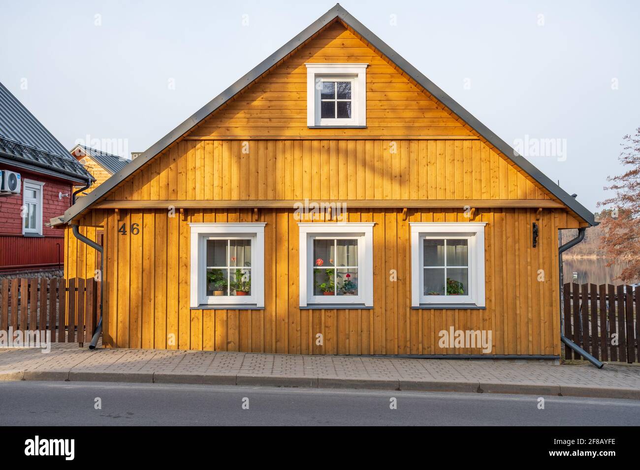 Old Lithuanian traditional yellow wooden house with three windows Stock ...