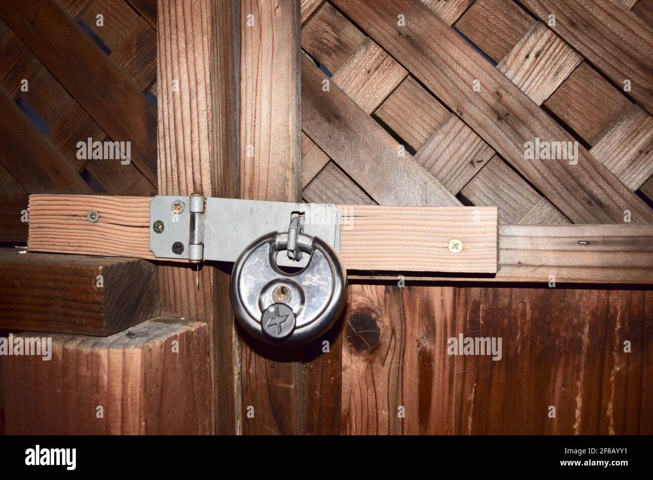 Rustic lock on the old wooden door Stock Photo - Alamy