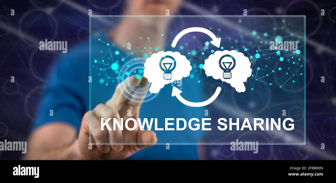 Man touching a knowledge sharing concept on a touch screen with his ...