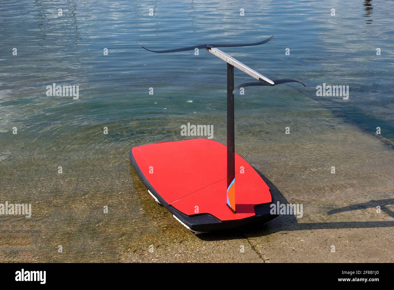 Windfoil board, upside down waiting to be launched to go windfoiling ...