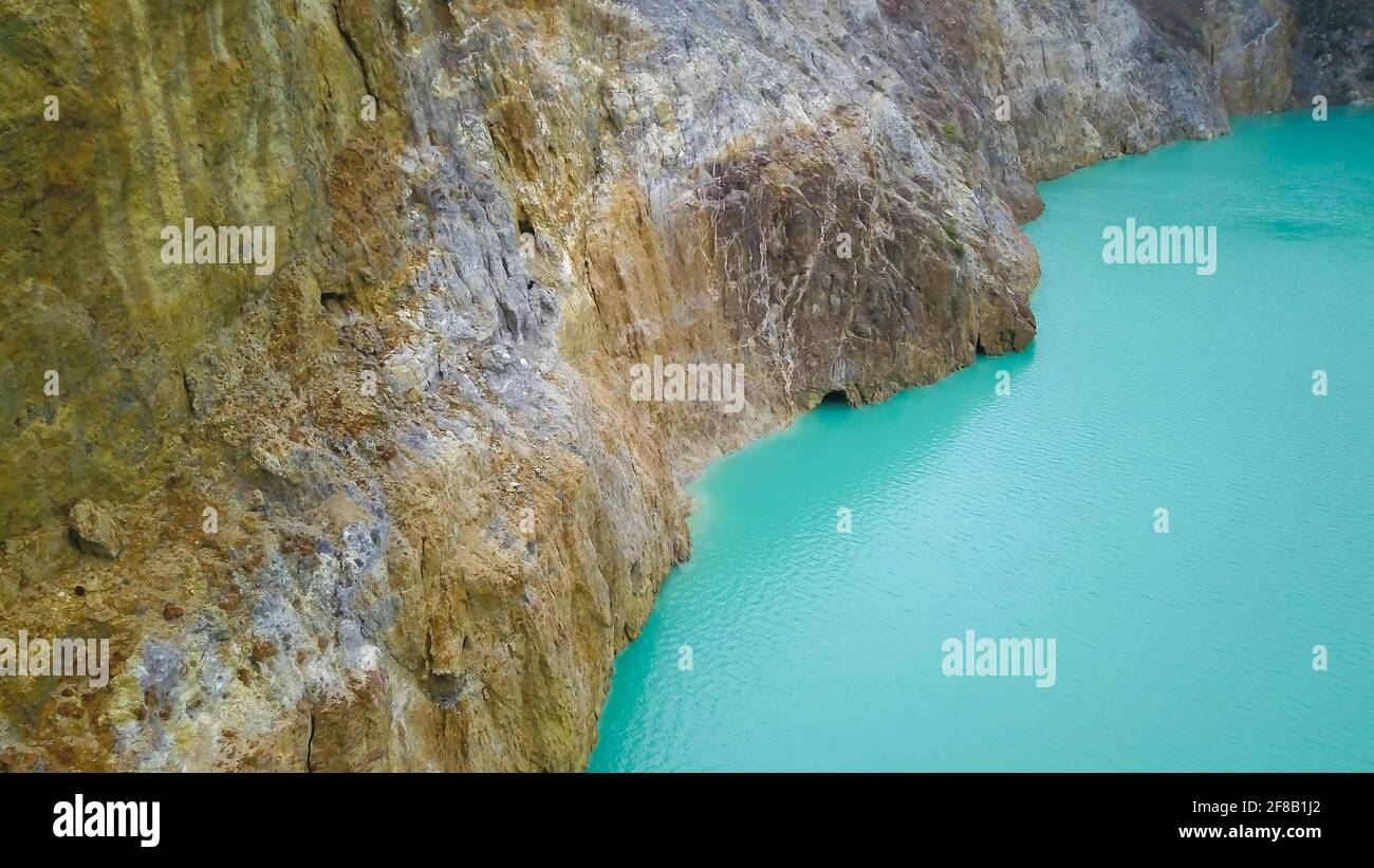 A close up view of the surface of Lake Alapolo and the crater wall ...