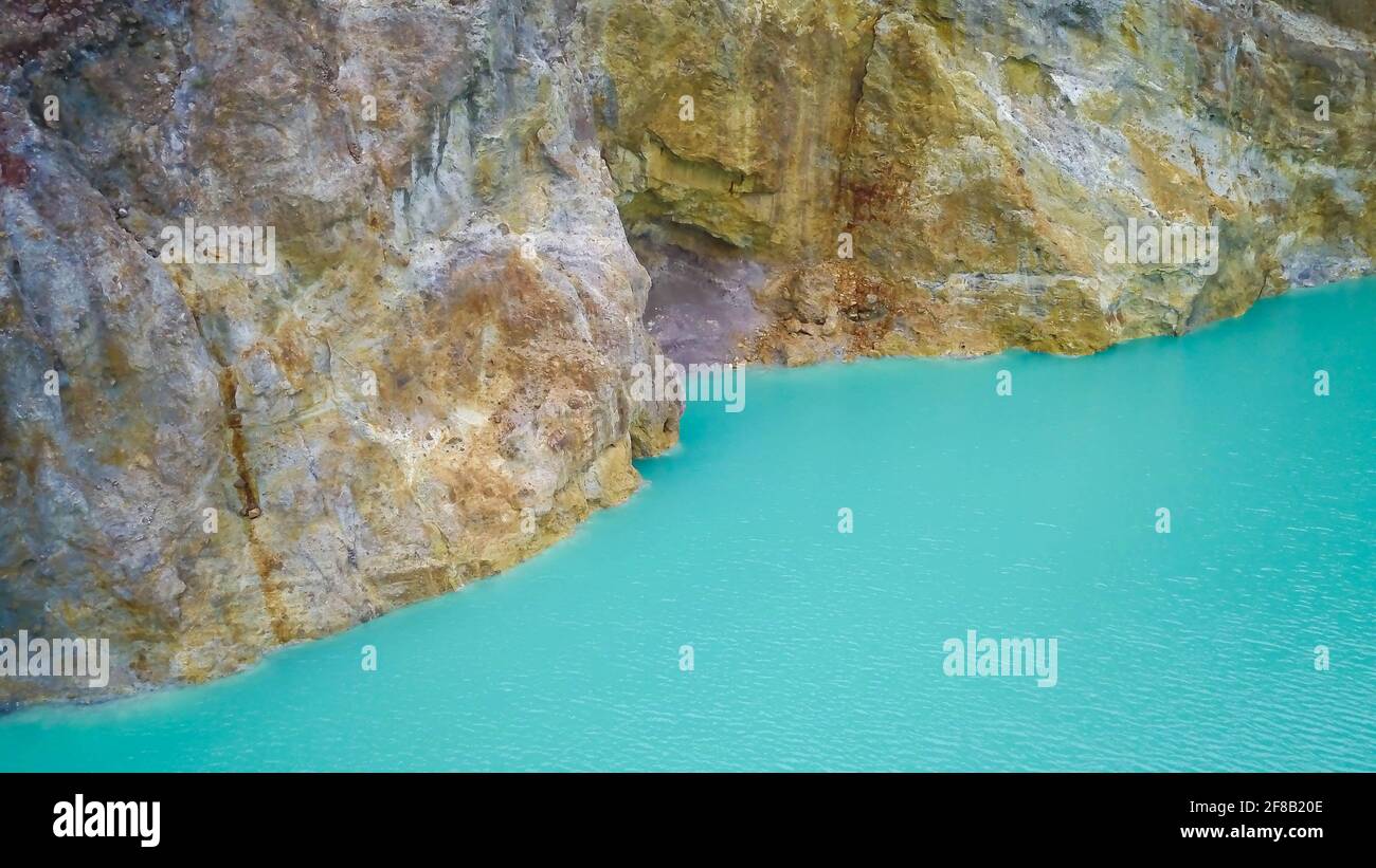 A close up view of the surface of Lake Alapolo and the crater wall ...