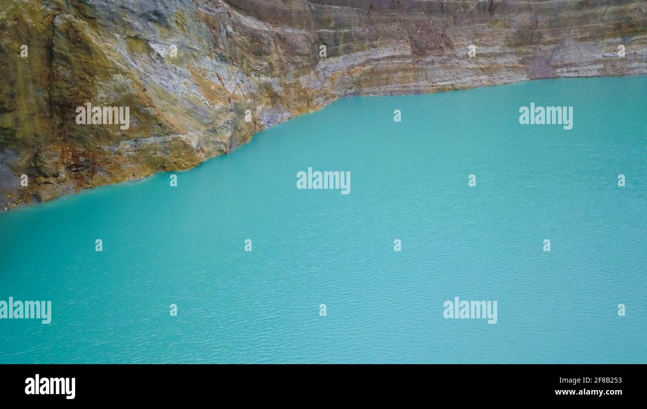 A close up view of the surface of Lake Alapolo and the crater wall ...