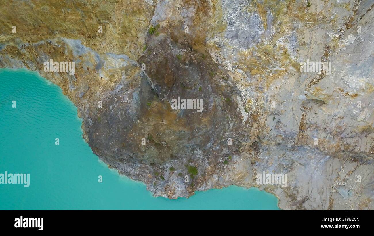 A close up view of the surface of Lake Alapolo and the crater wall ...