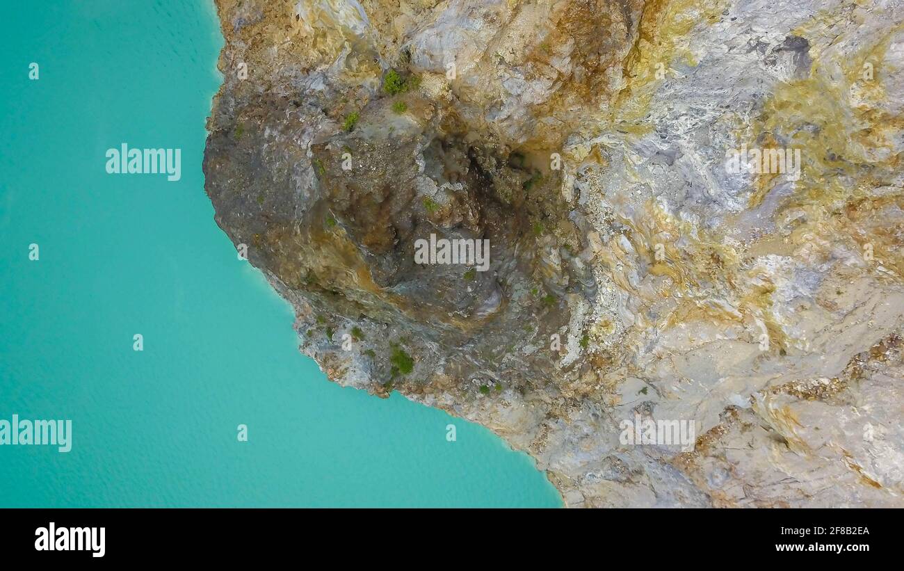 A close up view of the surface of Lake Alapolo and the crater wall ...