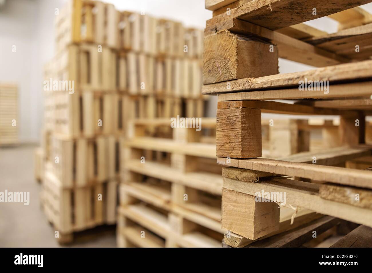 Arranged palettes ready to be used. Storage interior Stock Photo - Alamy