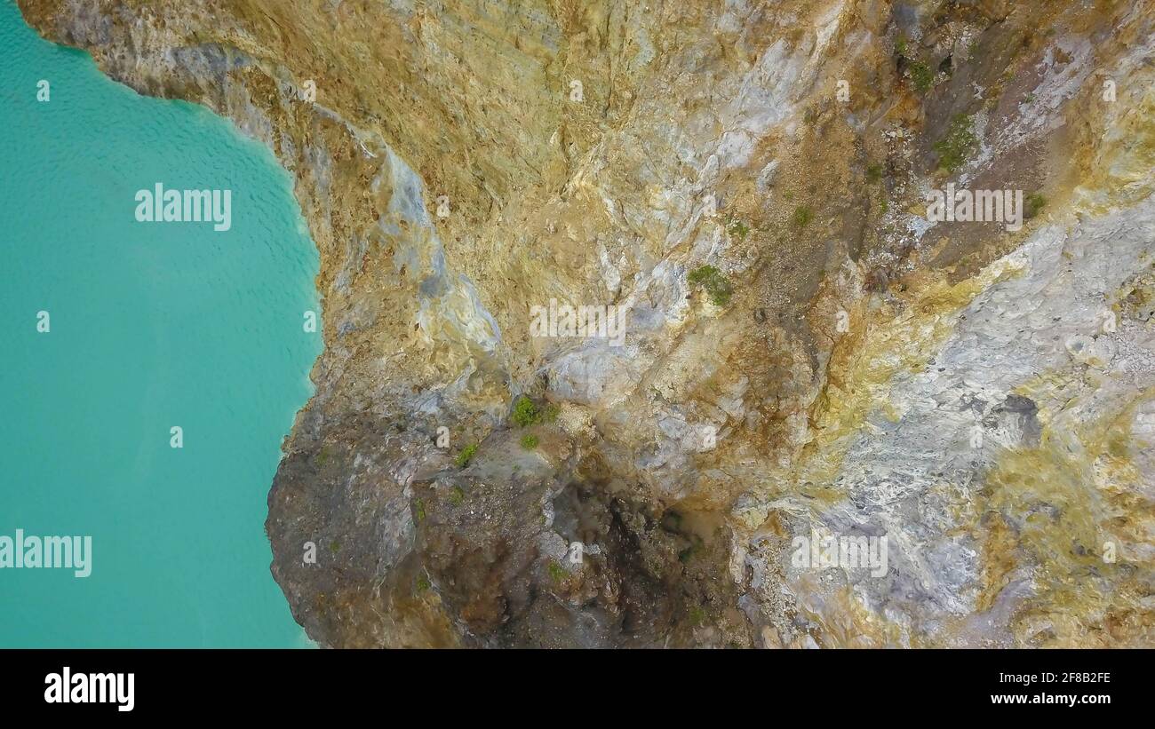 A close up view of the surface of Lake Alapolo and the crater wall ...