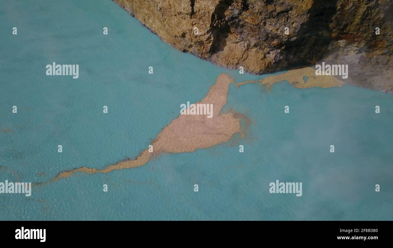 Top down view of sediments floating just below the surface of a ...