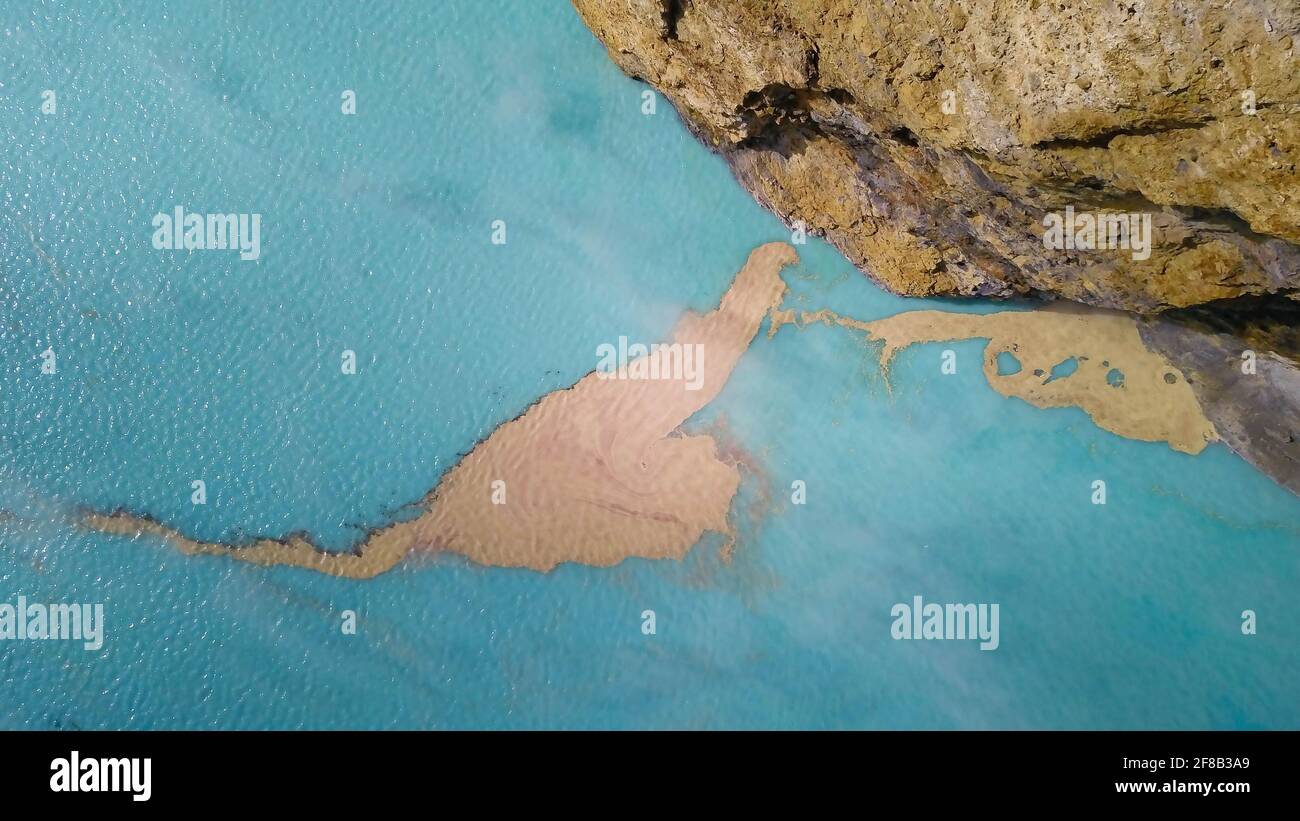 Top down view of sediments floating just below the surface of a ...