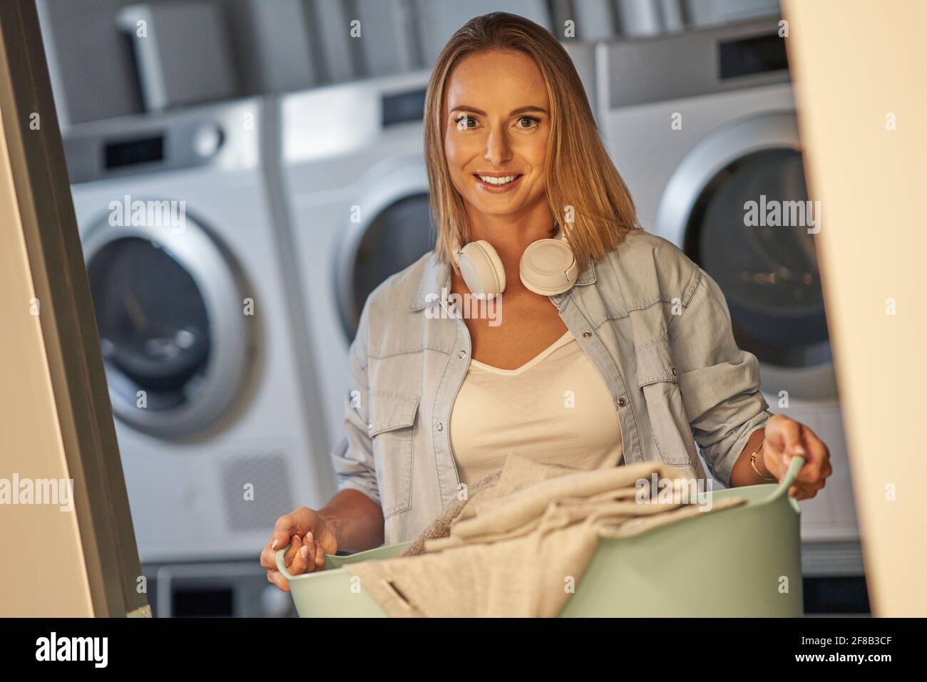 Young student in laundry room Stock Photo - Alamy