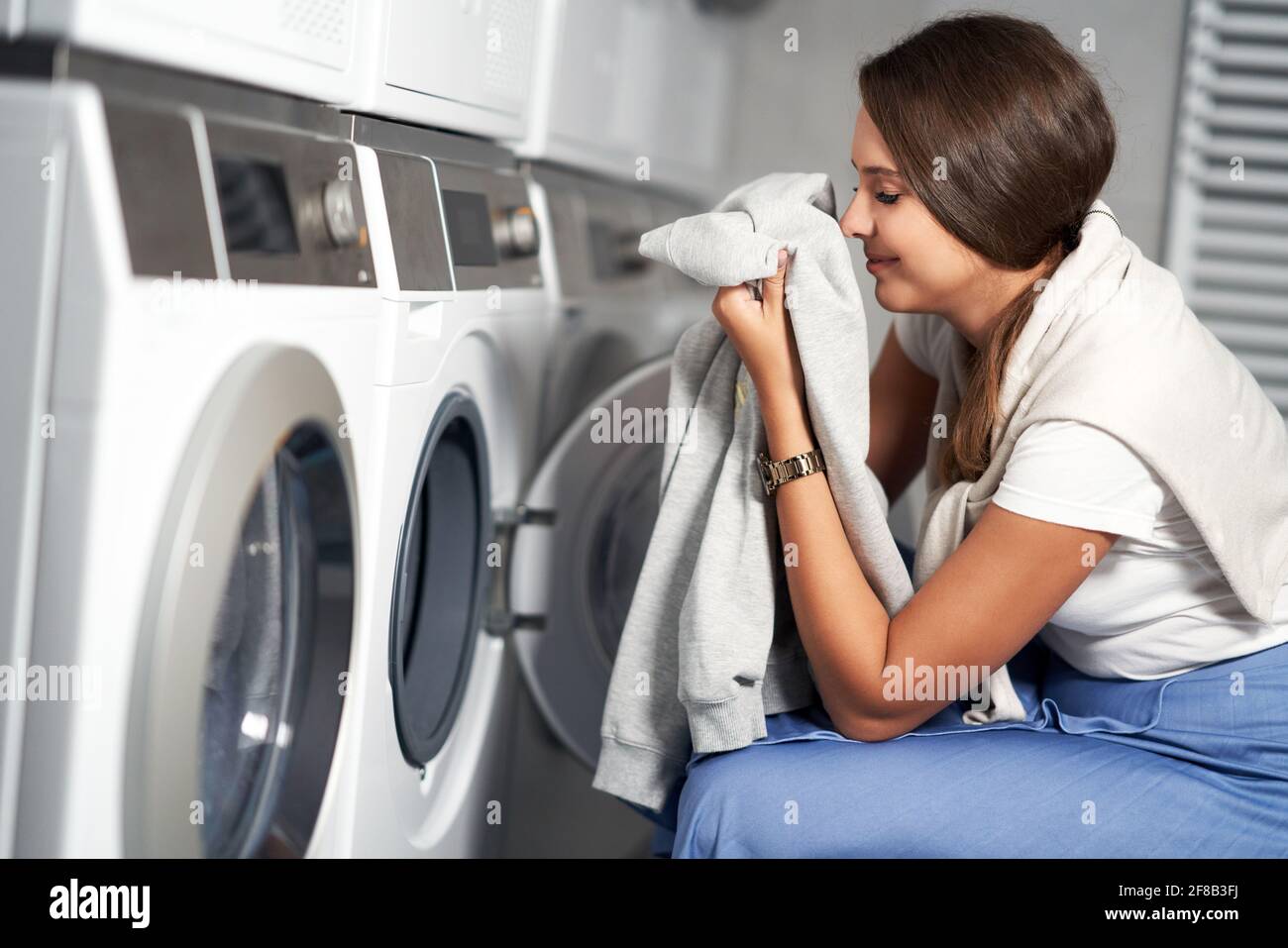 Young student in laundry room Stock Photo - Alamy