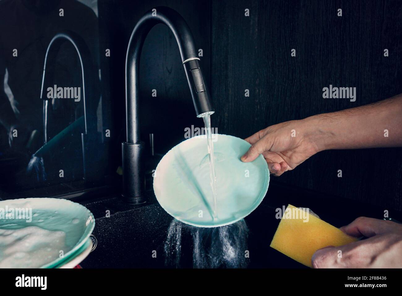 Close up man washing dishes hi-res stock photography and images - Alamy