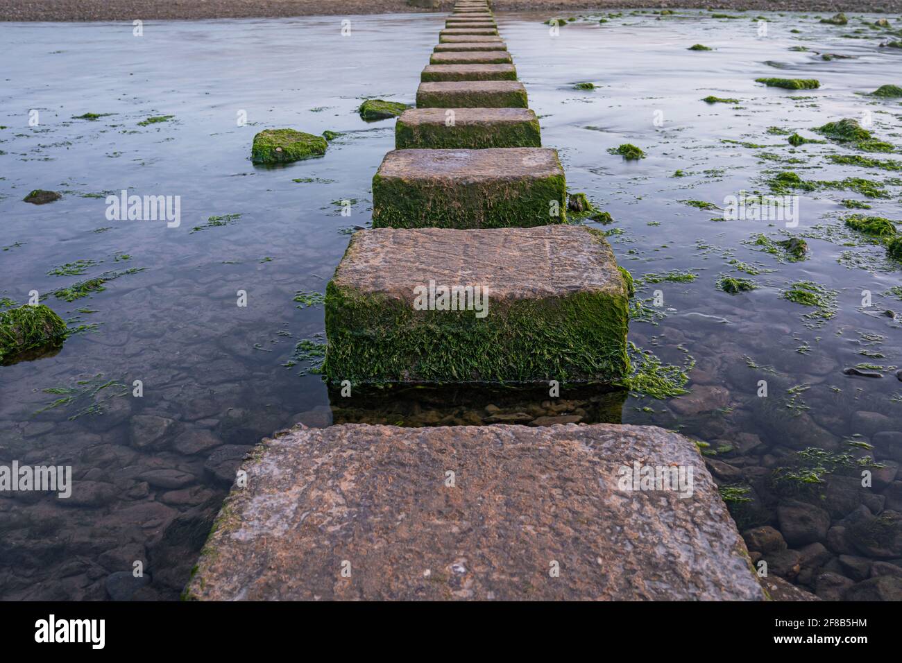 Three Cliffs Bay stepping stones across river, the Gower peninsula ...