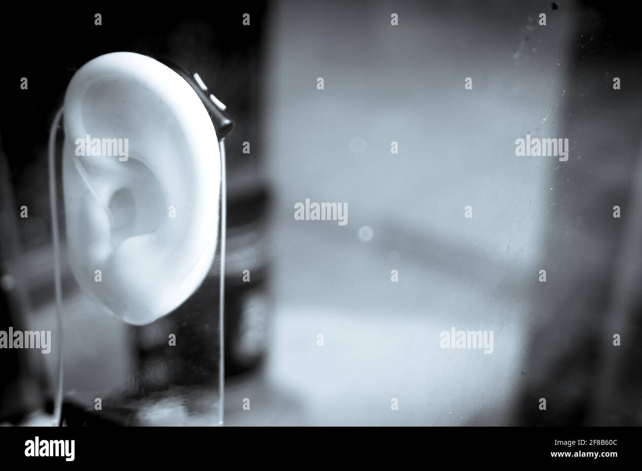 Plastic ear with modern hearing aid. No people Stock Photo - Alamy