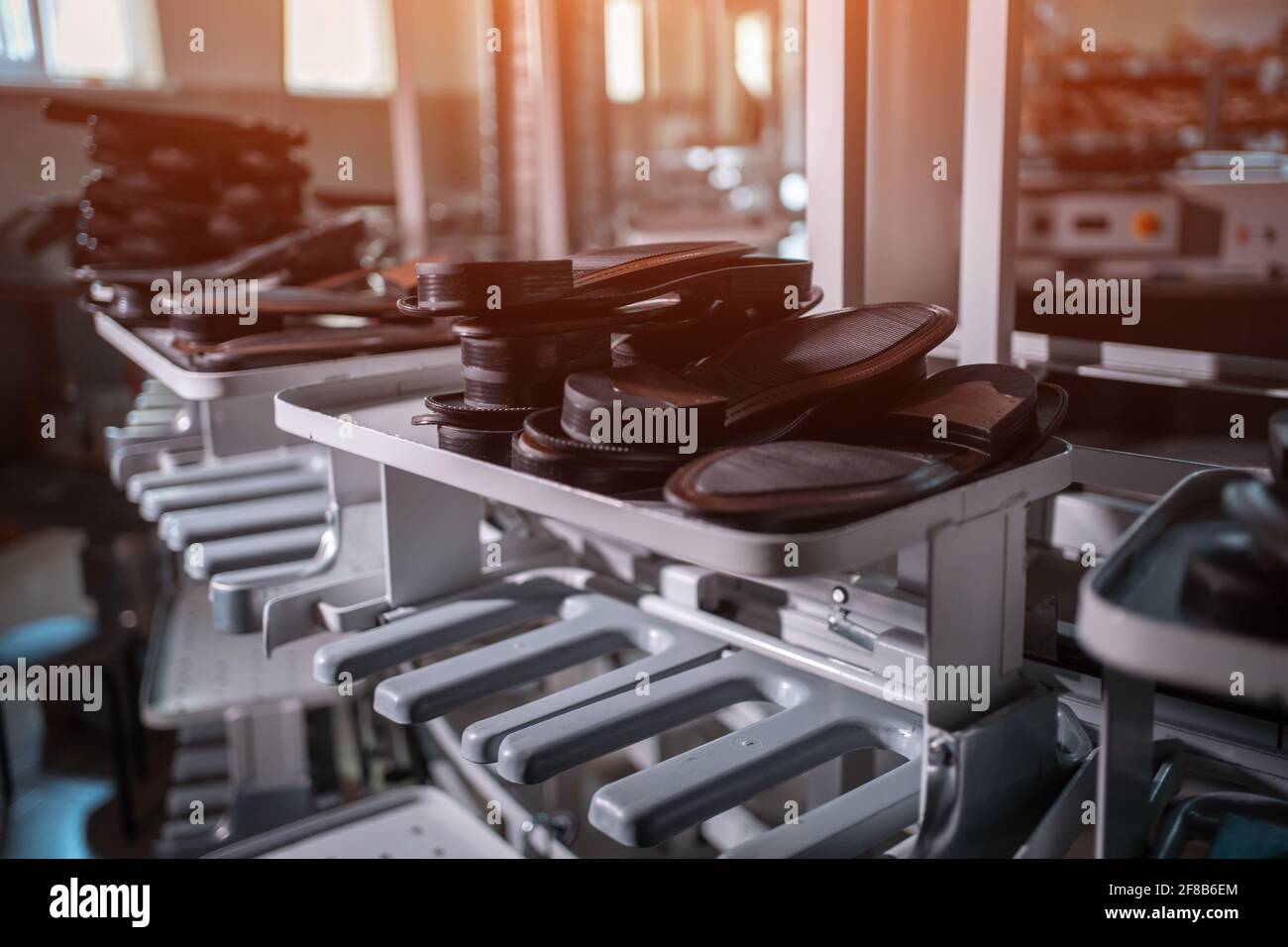 shelf with mold and insoles for shoe on modern factory Stock Photo - Alamy