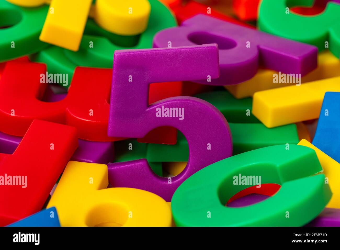 Purple number 5 on the pile of colorful letters and numbers Stock Photo ...