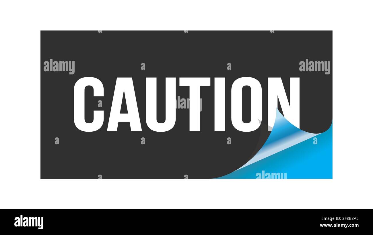 CAUTION text written on black blue sticker stamp Stock Photo - Alamy