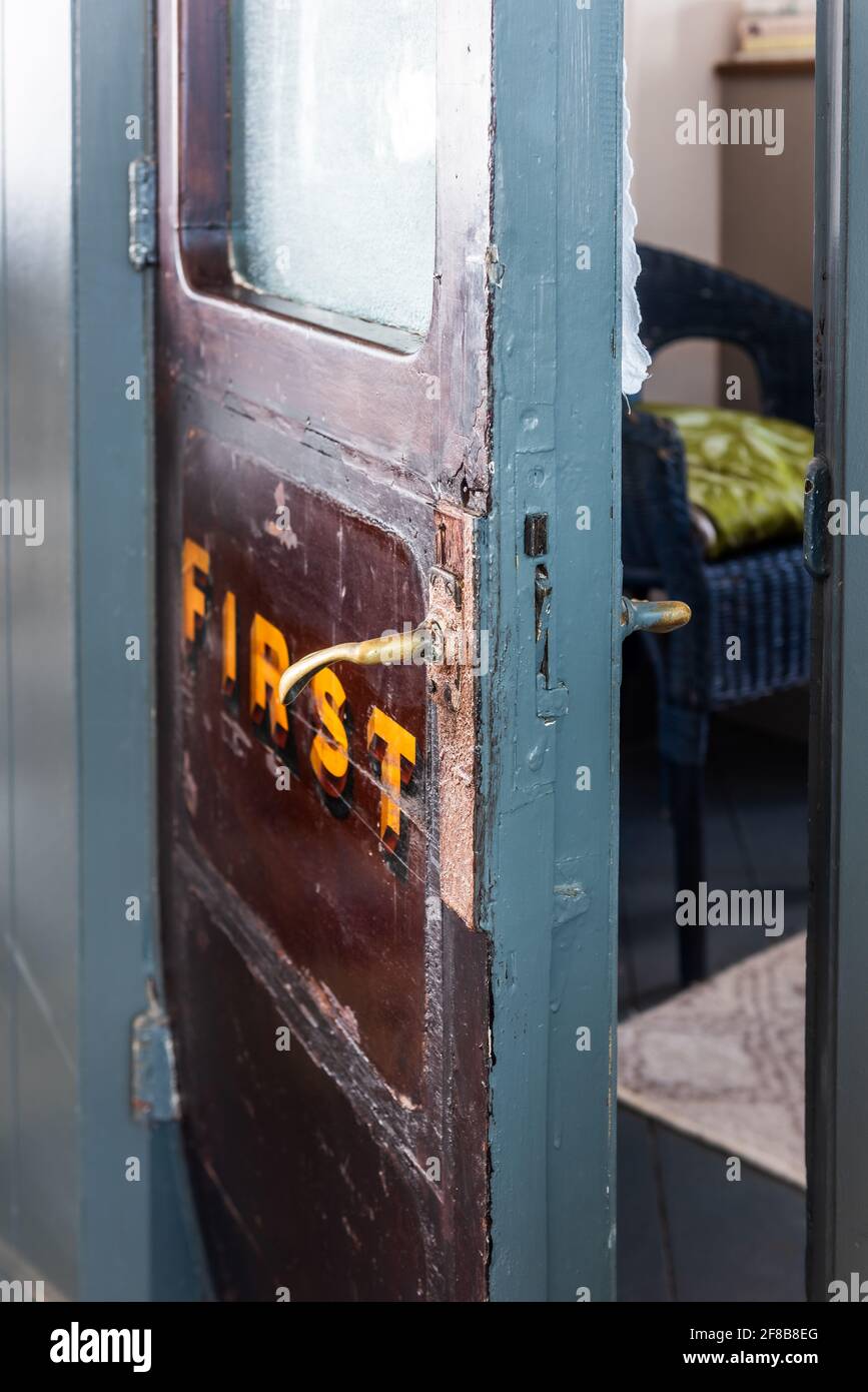 Original door of repurposed Victorian railway carriage in West Sussex ...