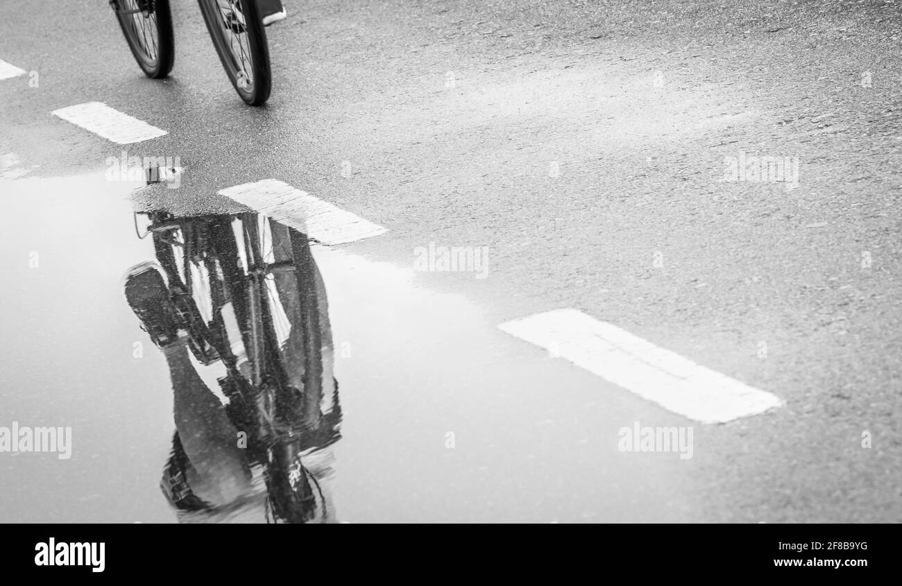 Bicycle reflected on a puddle Stock Photo - Alamy