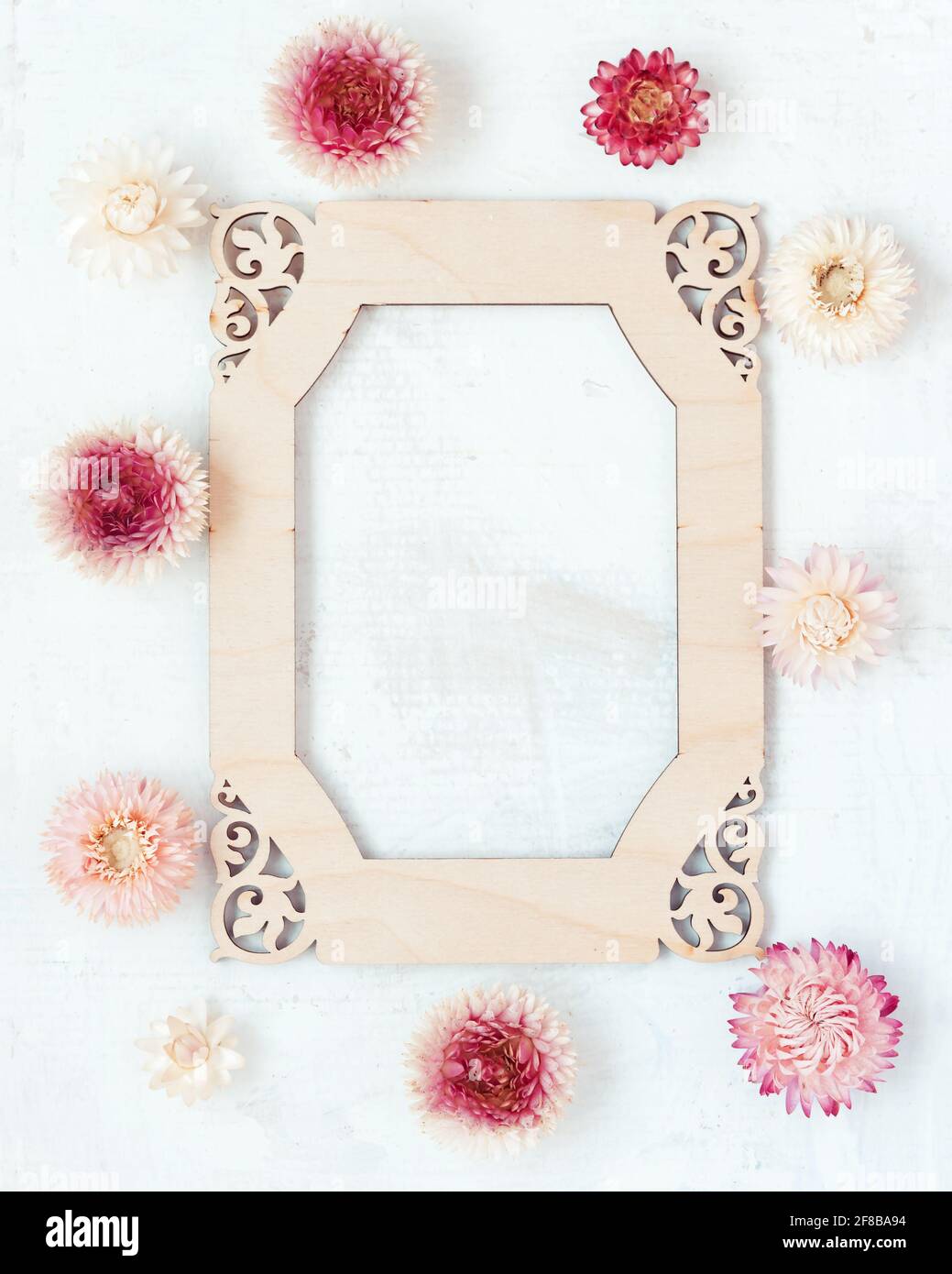 Retro rustic wedding invitation with floral pattern on wooden frame on ...