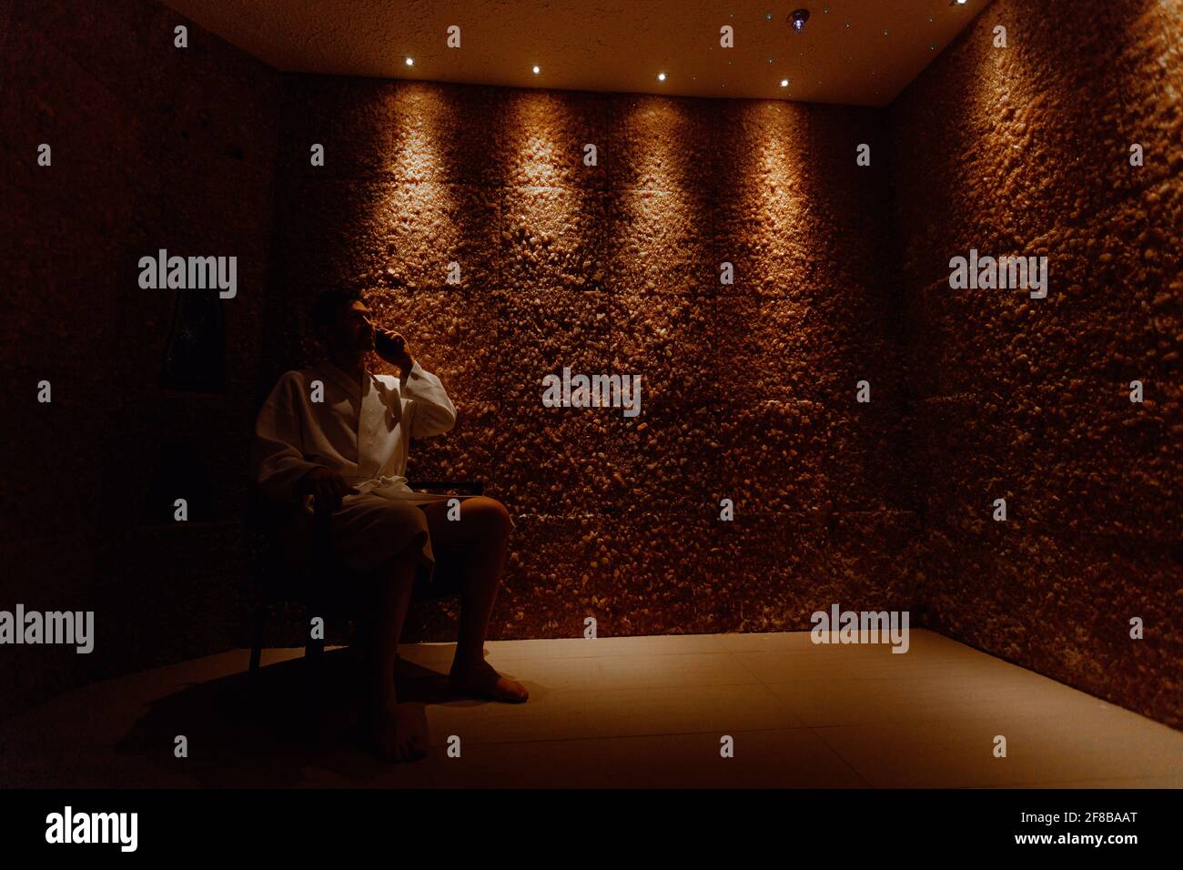 man relaxing in a salt room in the spa Stock Photo - Alamy