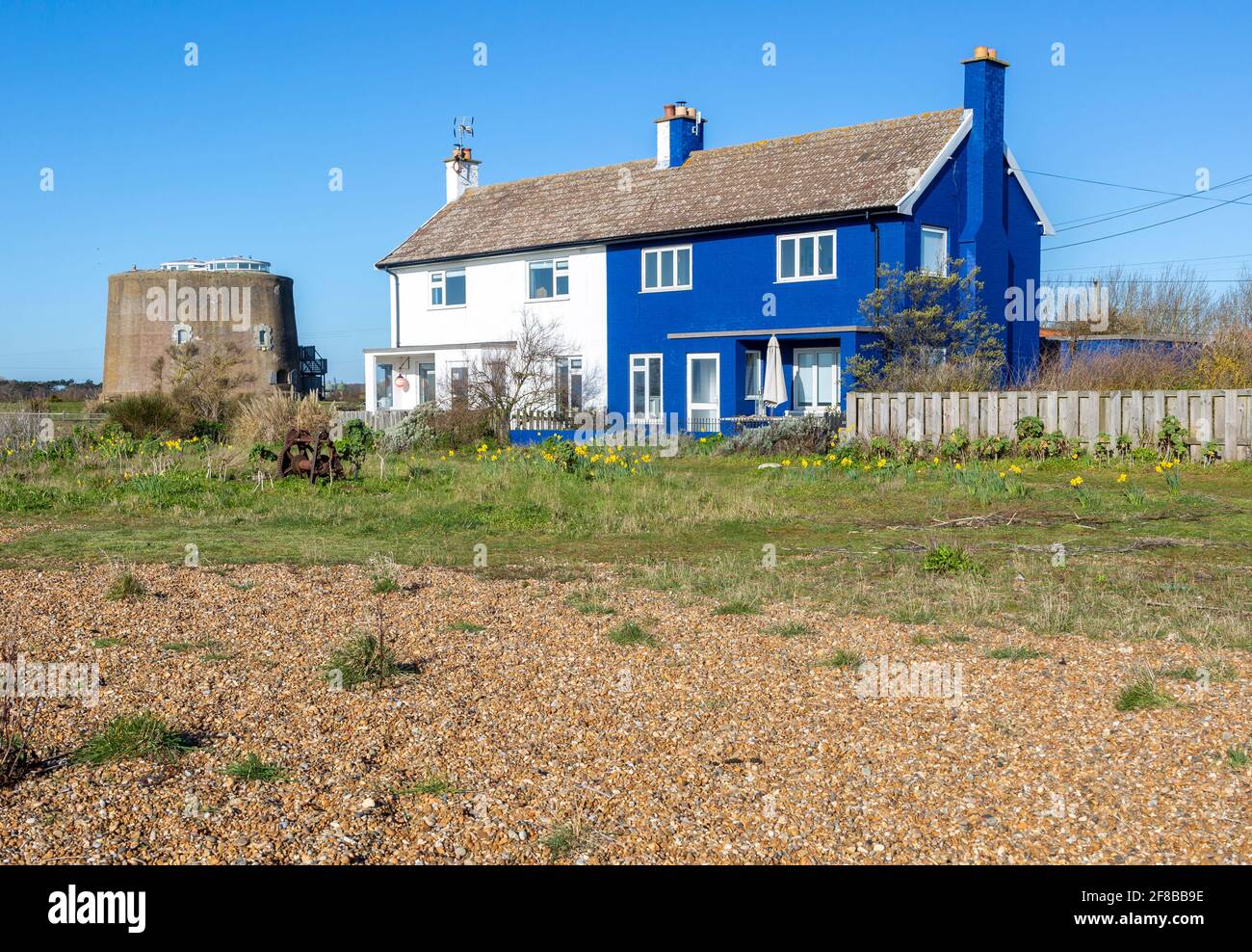 Semi-detached houses on the beach at Shingle Street, Suffolk, England ...