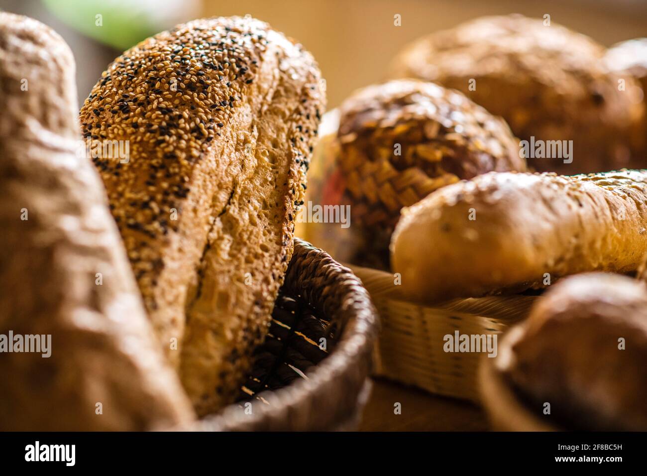 Assorted loaves of bread and rolls in baskets Stock Photo - Alamy