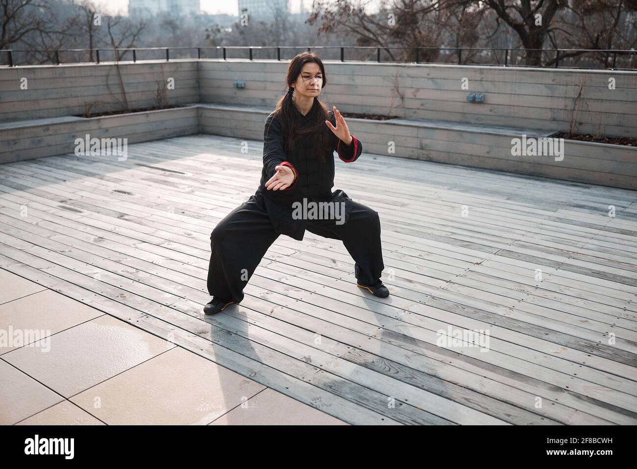 Wushu form used by an experienced female master Stock Photo - Alamy