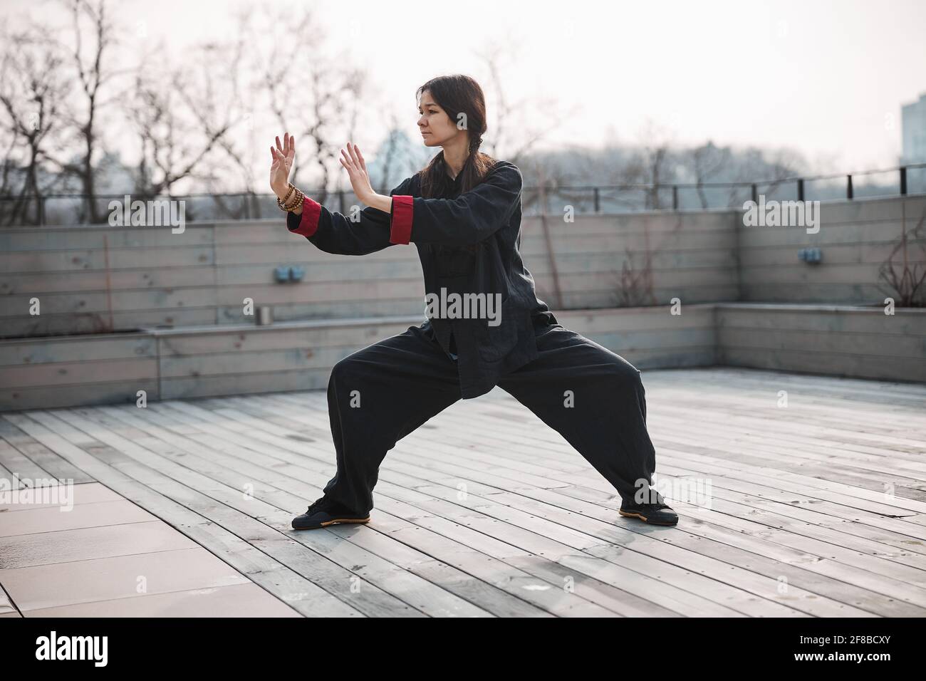 Experienced wushu master turned to left during activity Stock Photo - Alamy