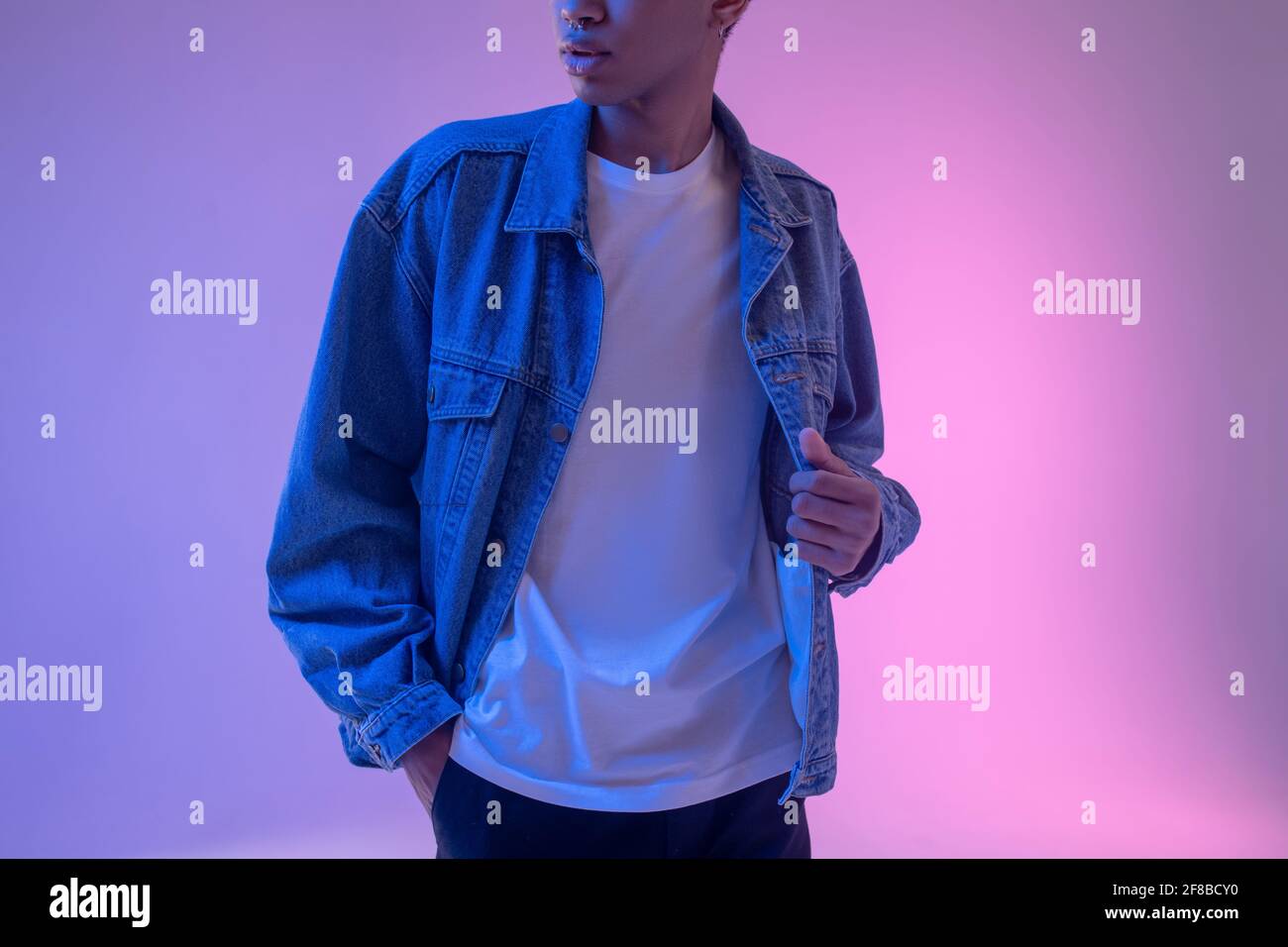 Stylish african american male model in denim jacket looking trendy ...
