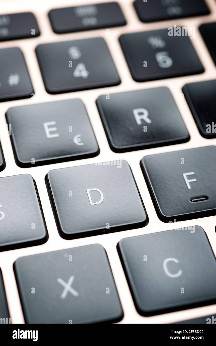 Forefront of a pink laptop keyboard Stock Photo - Alamy