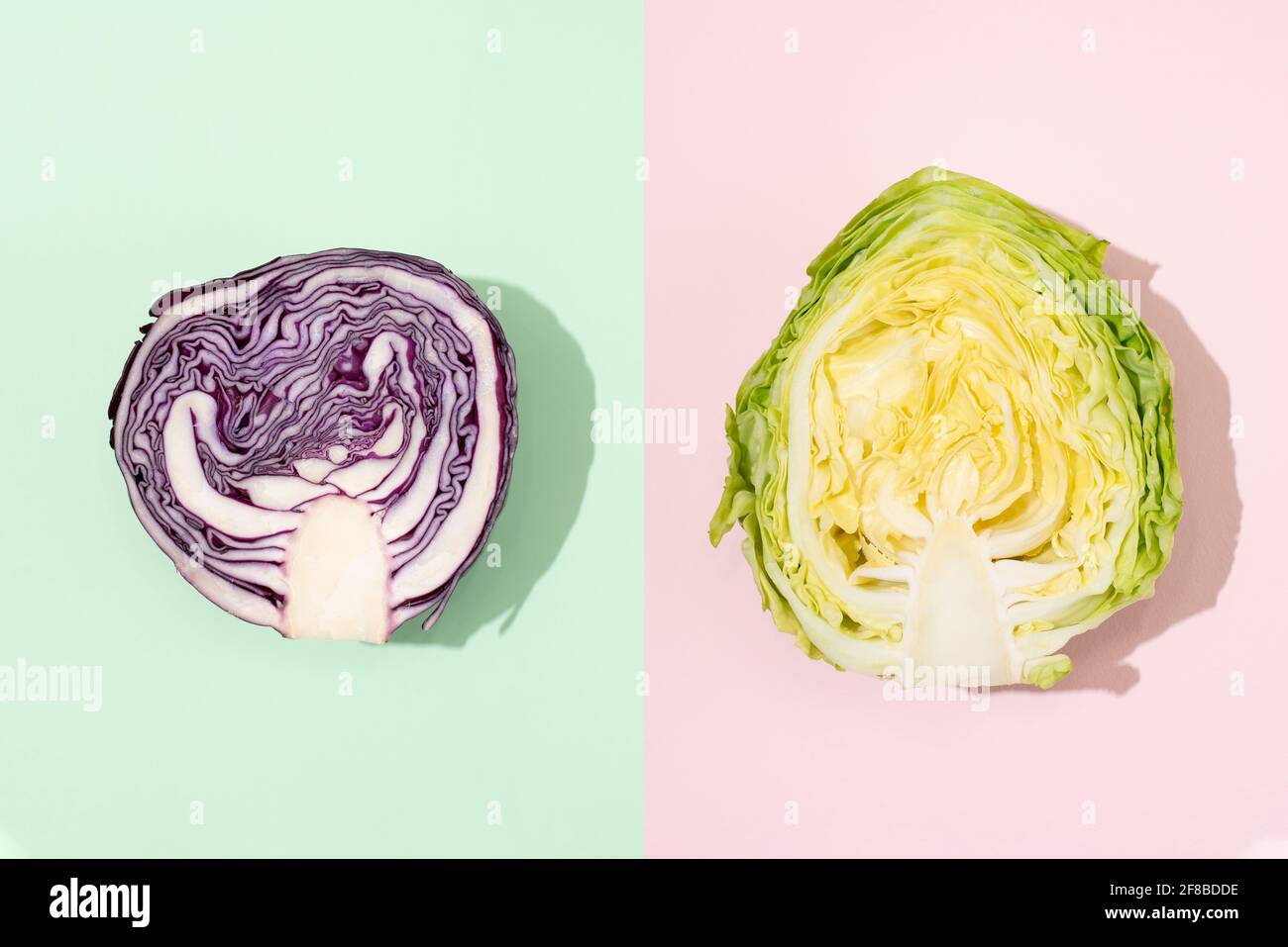 Halves of red and early cabbages on green and pink backgrounds, collage ...
