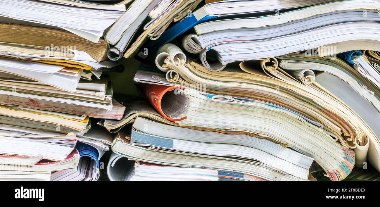 Huge heap of old books and notebooks piled together - stressed in ...