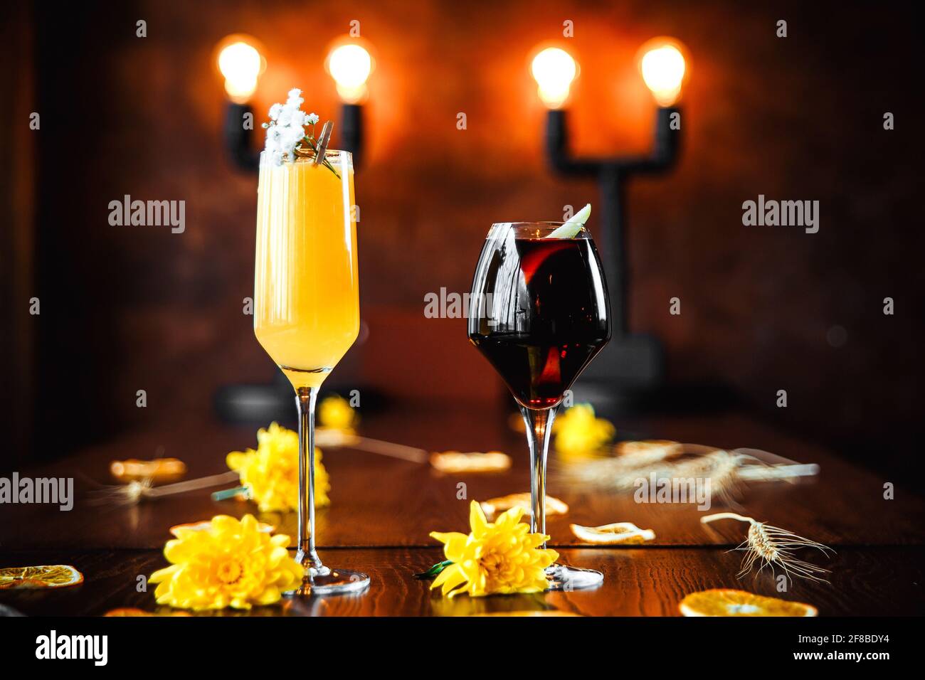 Two sweet cocktails on the decorated background Stock Photo - Alamy